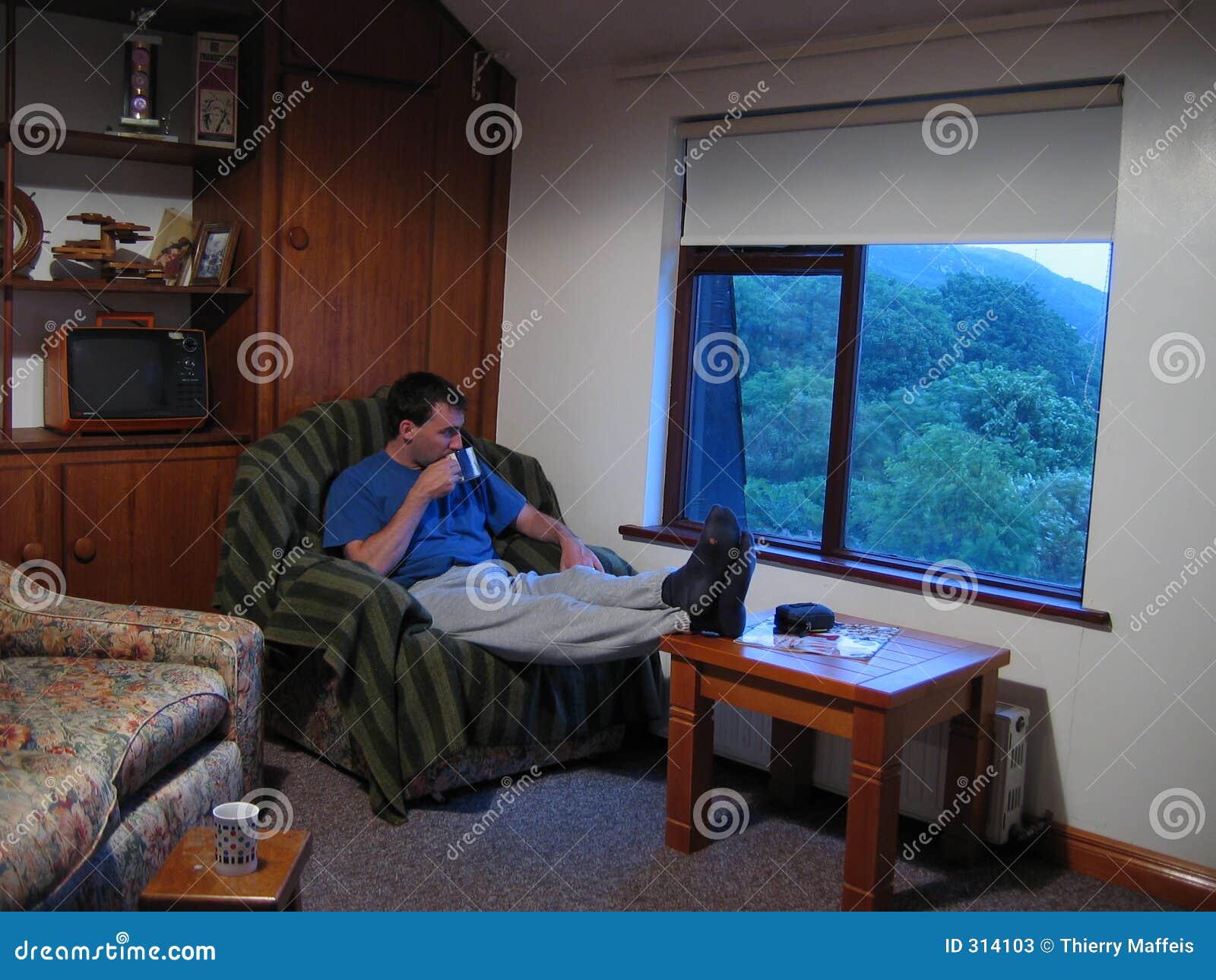 Man In Armchair Stock Image Image Of Storm Window Table 314103