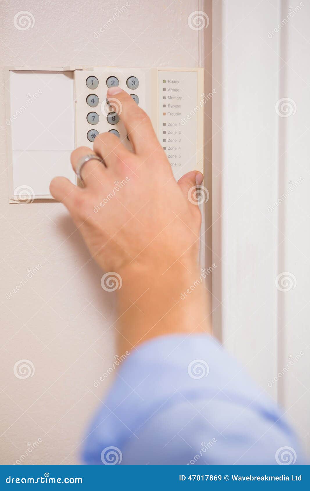 Man arming a home alarm stock image. Image of display - 47017869