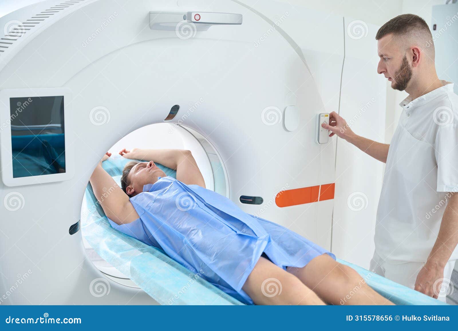 Radiographer is Preparing Adult Patient for CT Procedure Stock Photo ...
