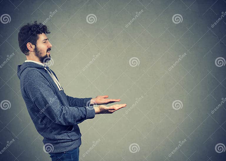 Young Man with Arms Raised Asking for Help Assistance Stock Photo ...