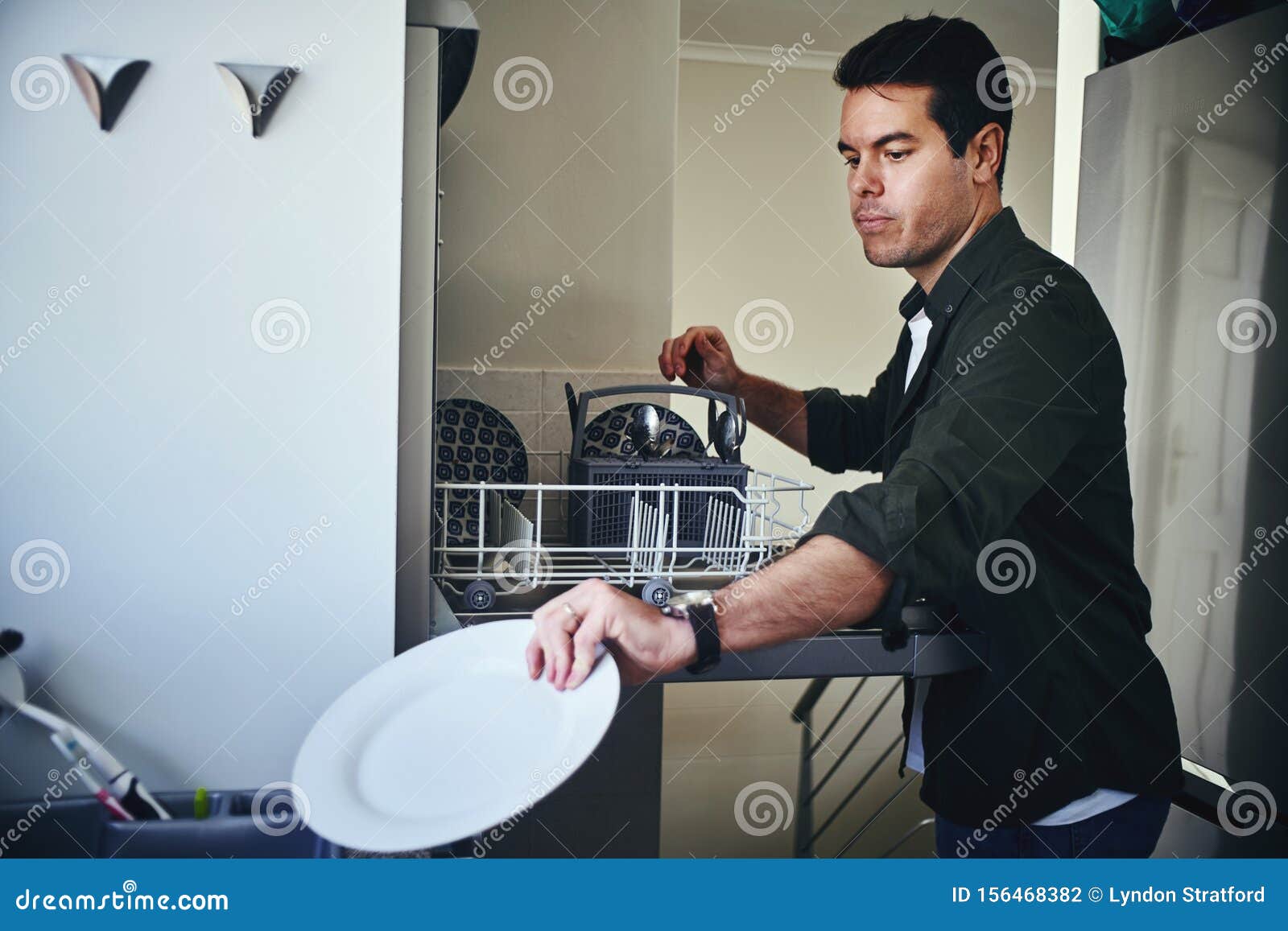 Man Loading Dishwasher in Kitchen Stock Photo - Image of housekeeper ...