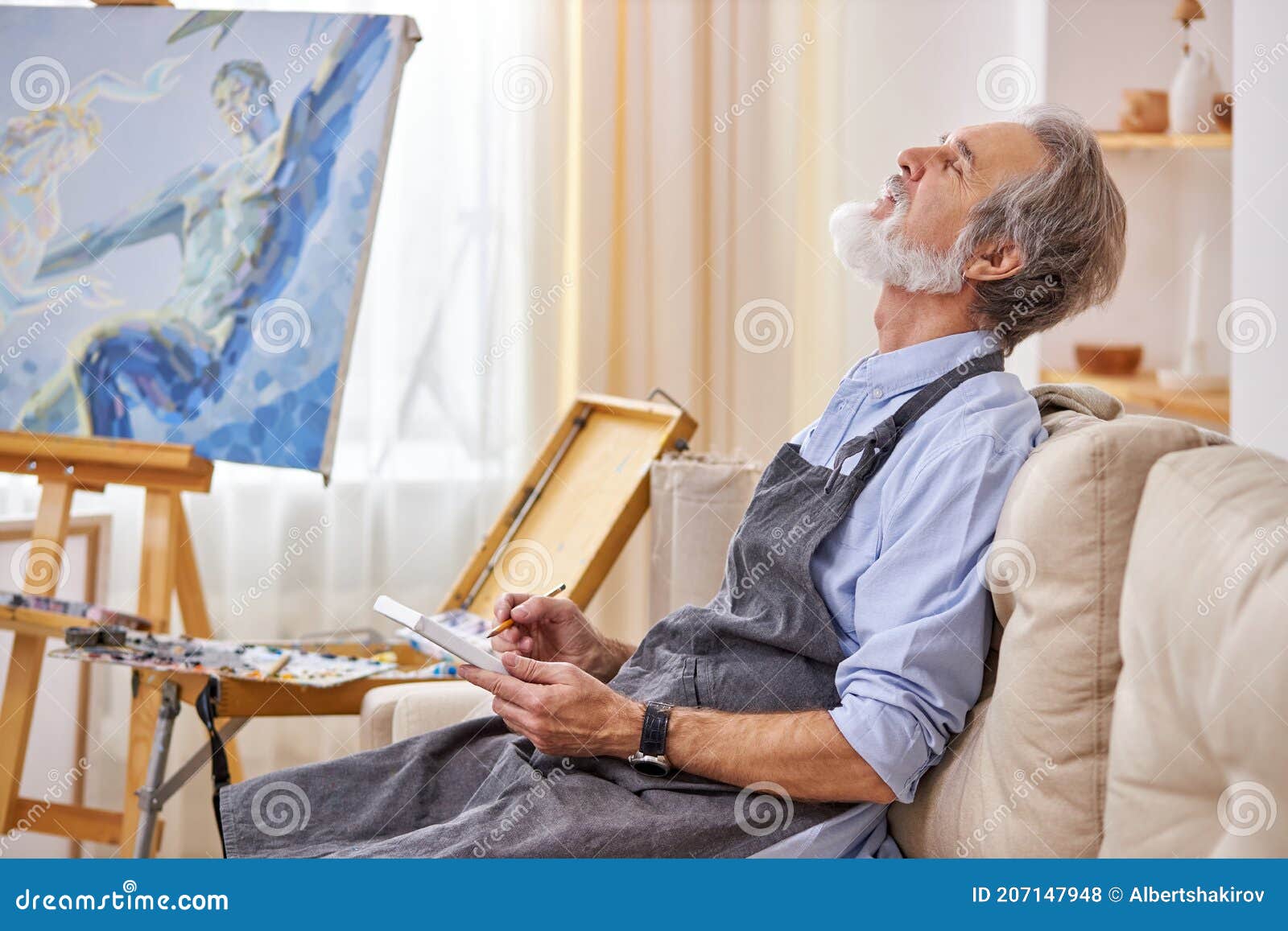 A Man Artist is Waiting for a Muse To Create a Masterpiece, Immersed in ...