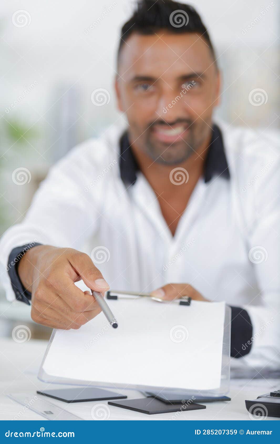 Man asks to sign invoice stock image. Image of uniform - 285207359