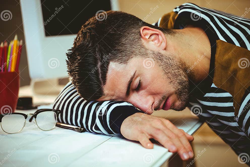 Man asleep at his desk stock image. Image of studio, agency - 62325713
