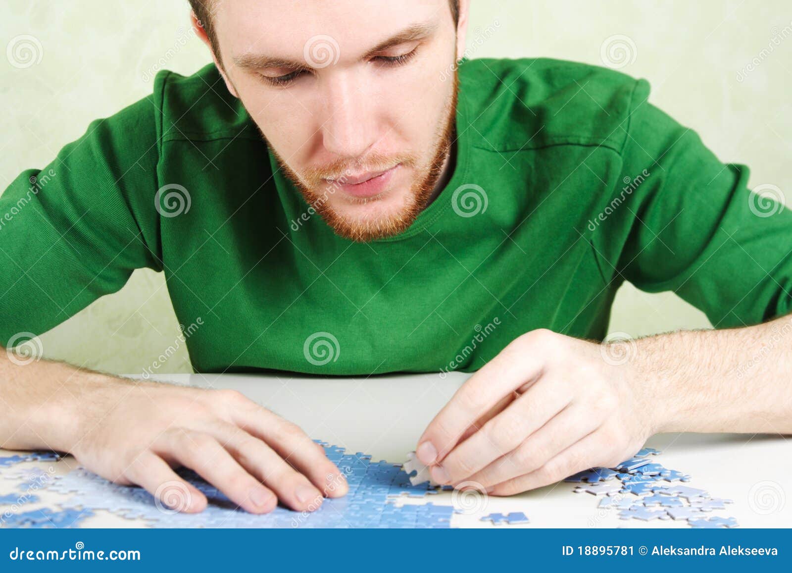 Man Assembling Blue Puzzle Pieces Stock Image - Image of hold, game ...