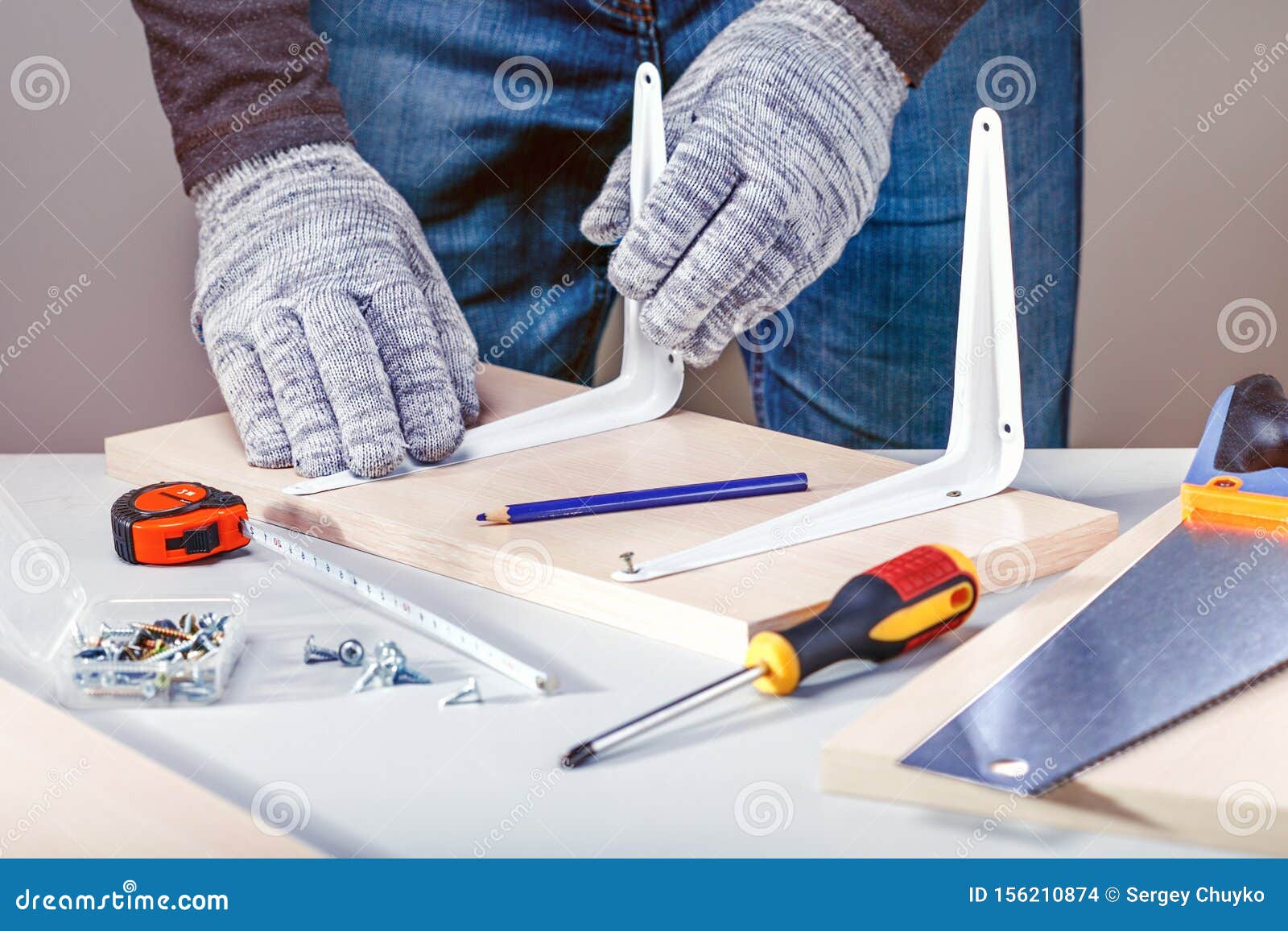 Man Assembling Furniture Using Manual Tools. Stock Photo - Image of ...