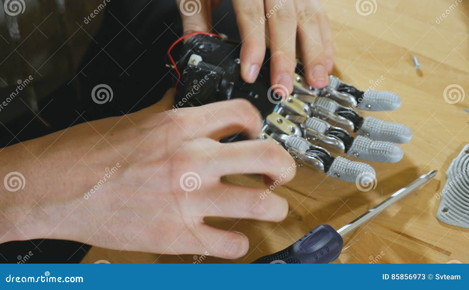 Man Assembling Innovative Cybernetic Bionic Arm. Hi-tech Innovative ...