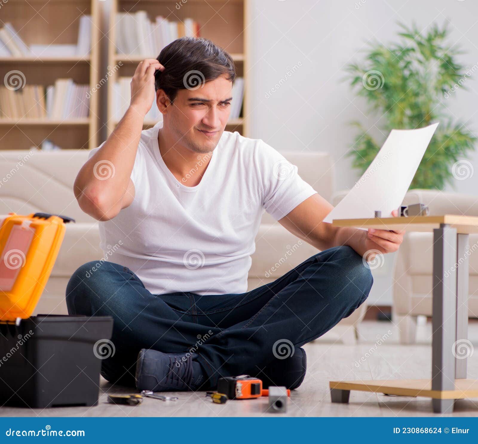 Man Assembling Shelf at Home Stock Photo - Image of fasten, installing ...