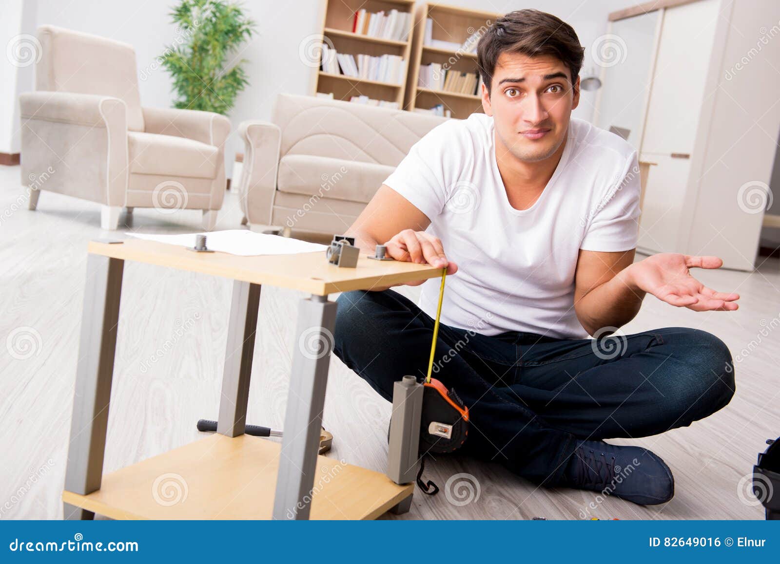 The Man Assembling Shelf at Home Stock Photo - Image of puzzled ...