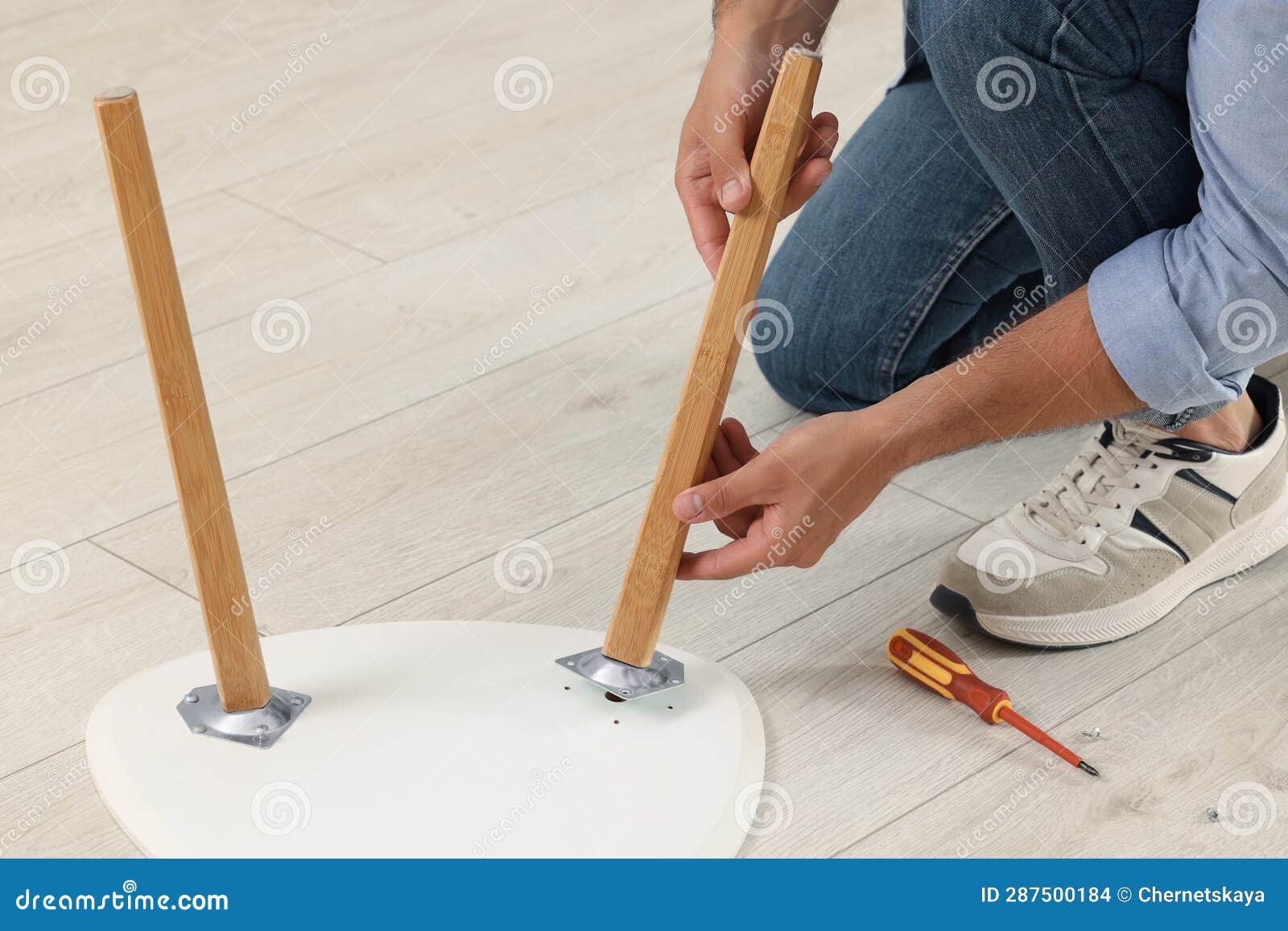 Man Assembling Table on Floor, Closeup View Stock Photo - Image of ...