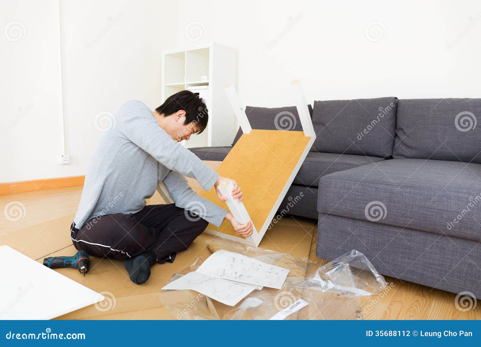 Man assembling table stock photo. Image of home, packing - 35688112