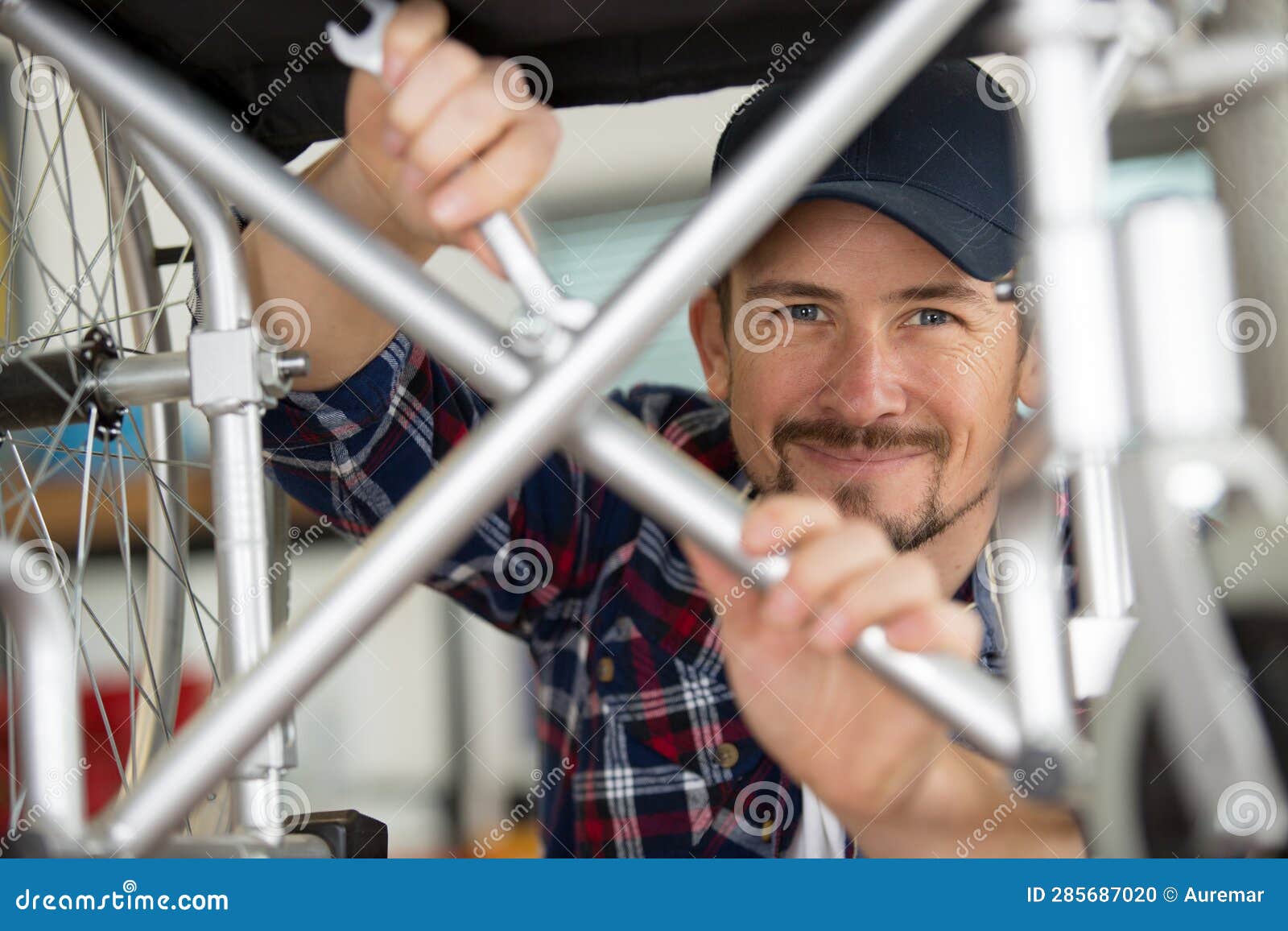 Man Assembling Wheelchair in Workshop Stock Photo - Image of wheelchair ...
