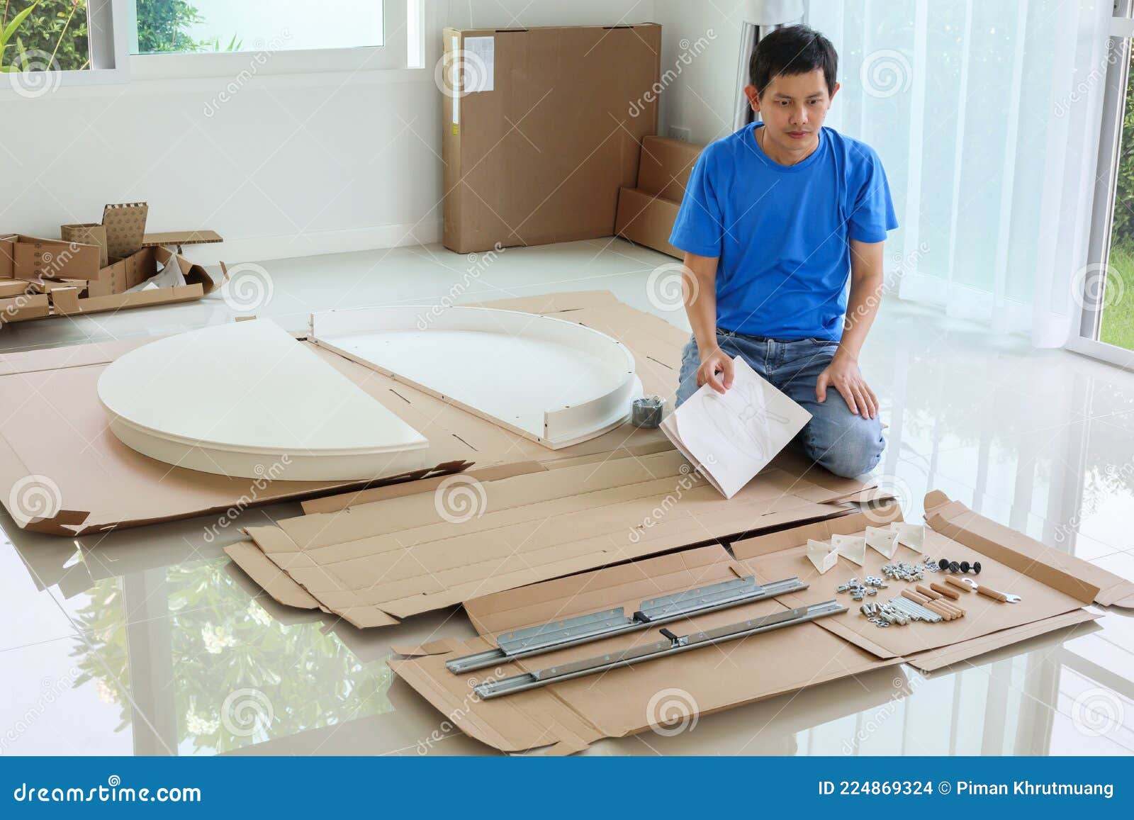 Man Assembling White Round Table Furniture at Home Stock Photo - Image ...