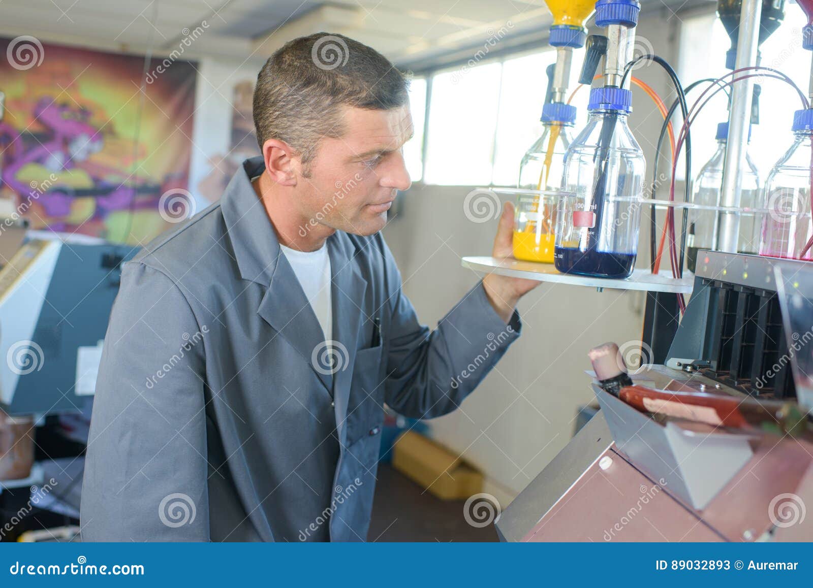 Man assessing bottles ink stock image. Image of worker - 89032893