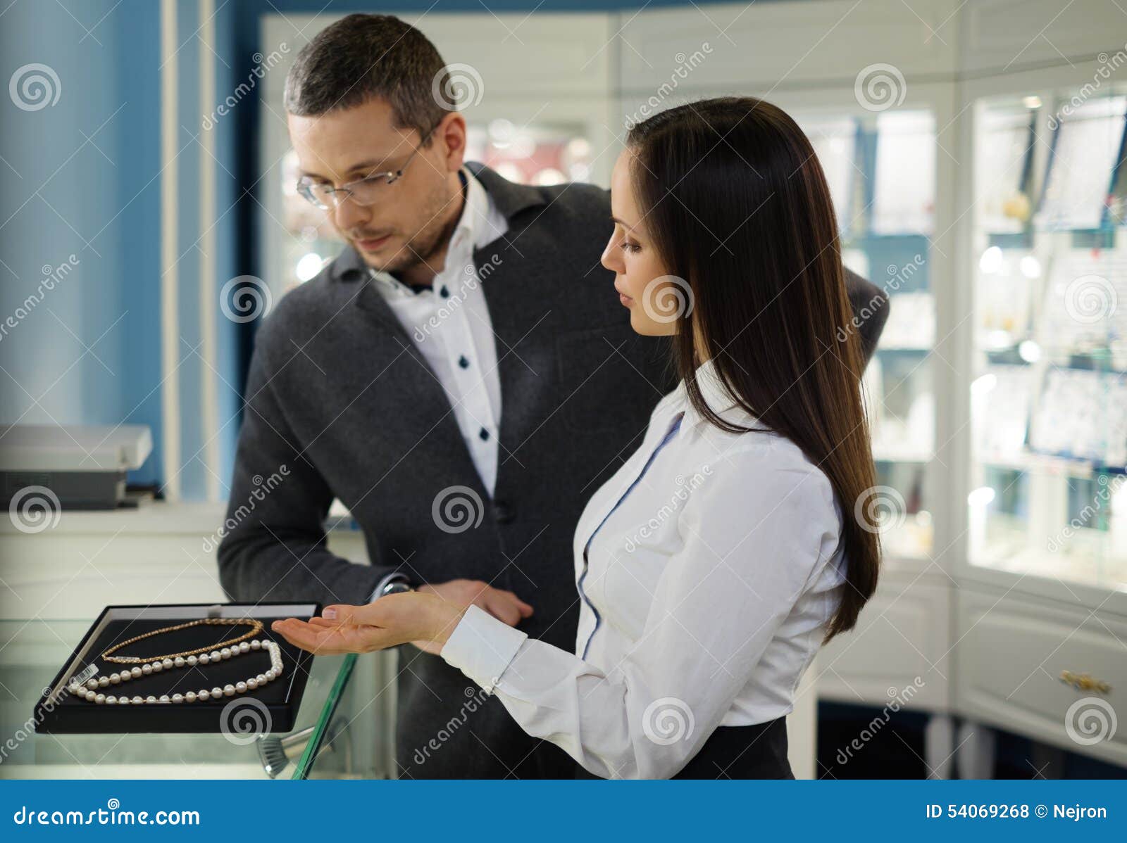 Man with Assistant in Jewellery Shop Stock Photo - Image of engagement ...