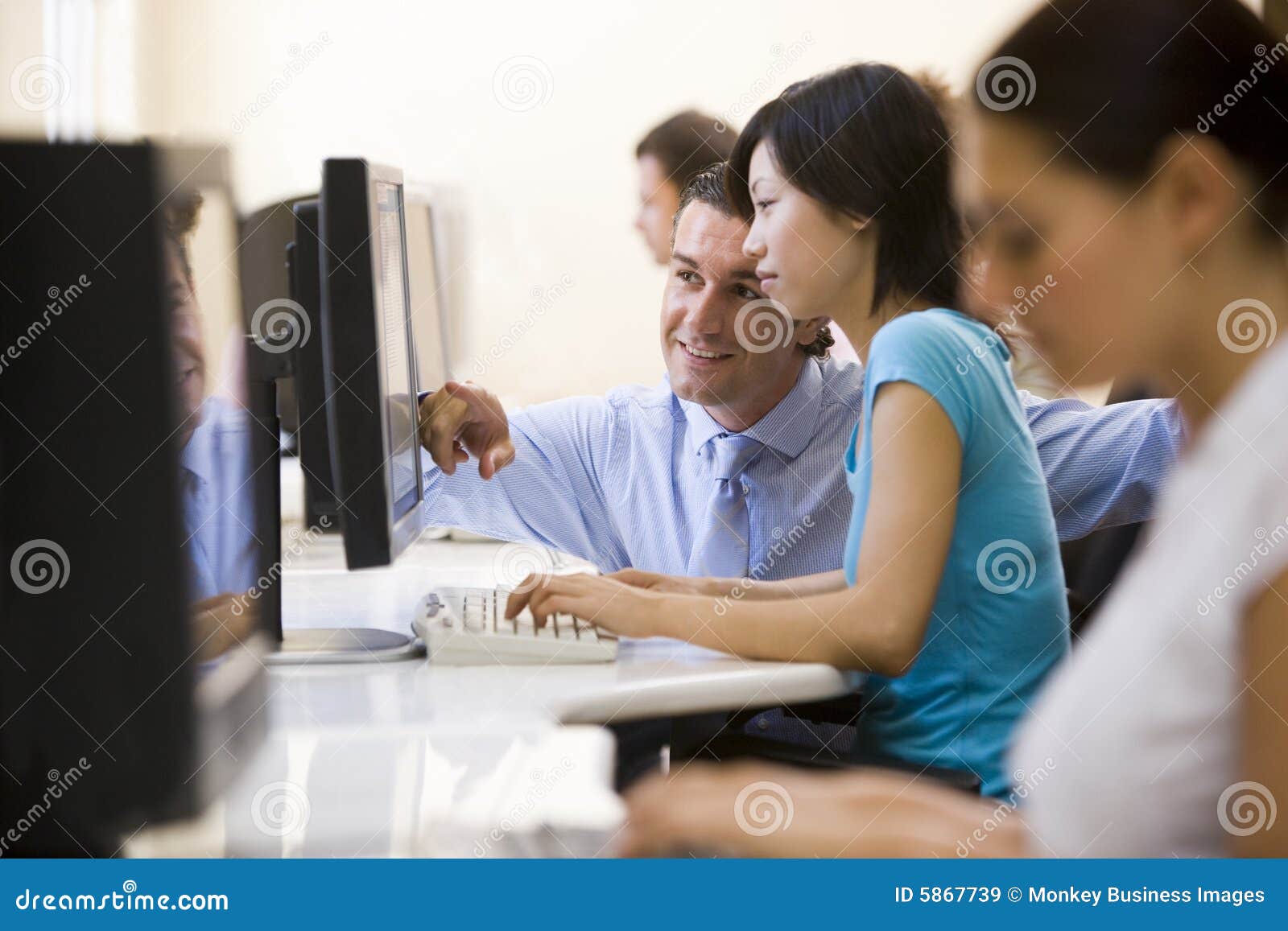Man Assisting Woman in Computer Room Smiling Stock Image - Image of ...