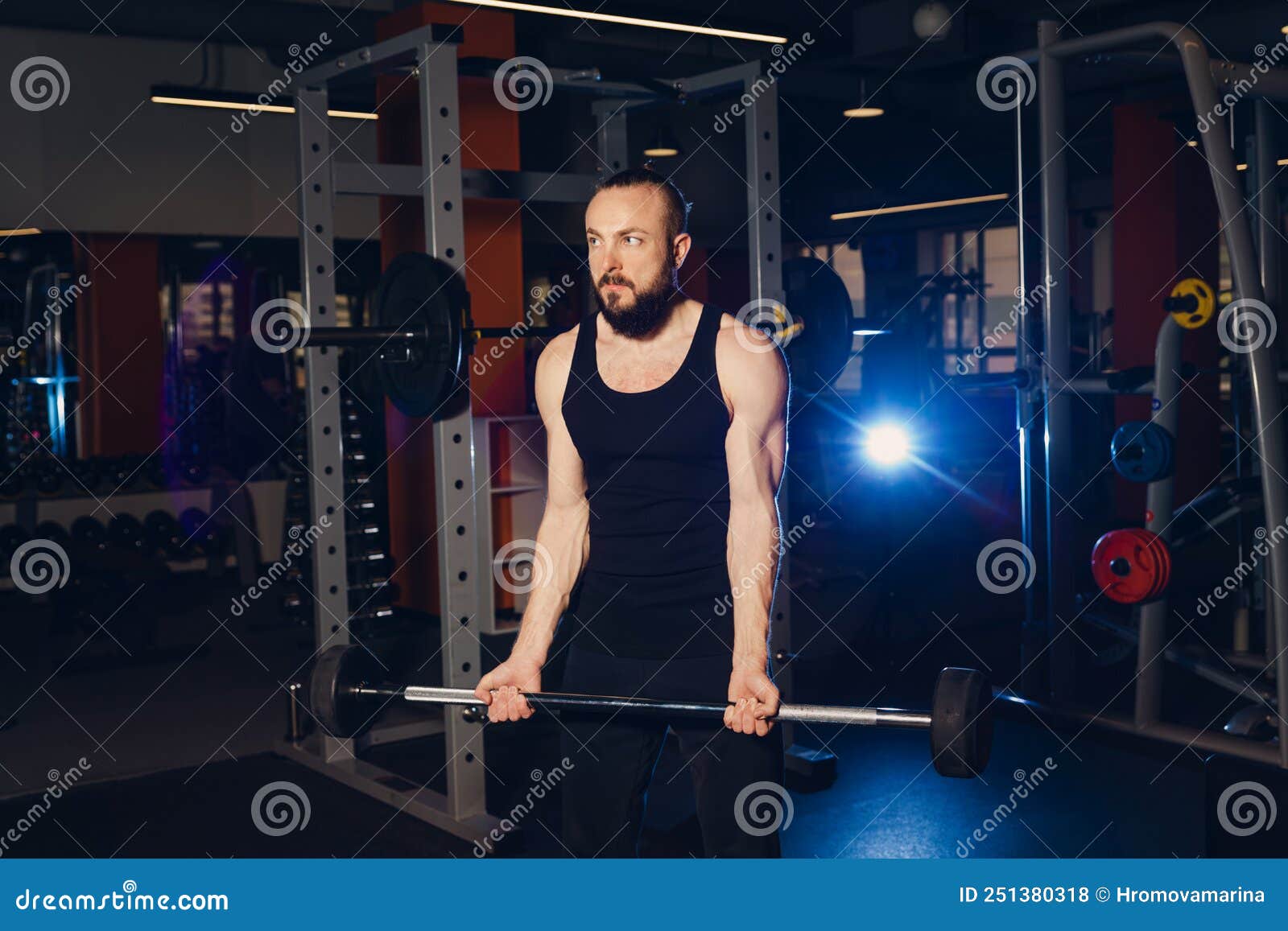 A Man of Athletic Build is Preparing To Perform an Exercise with a ...