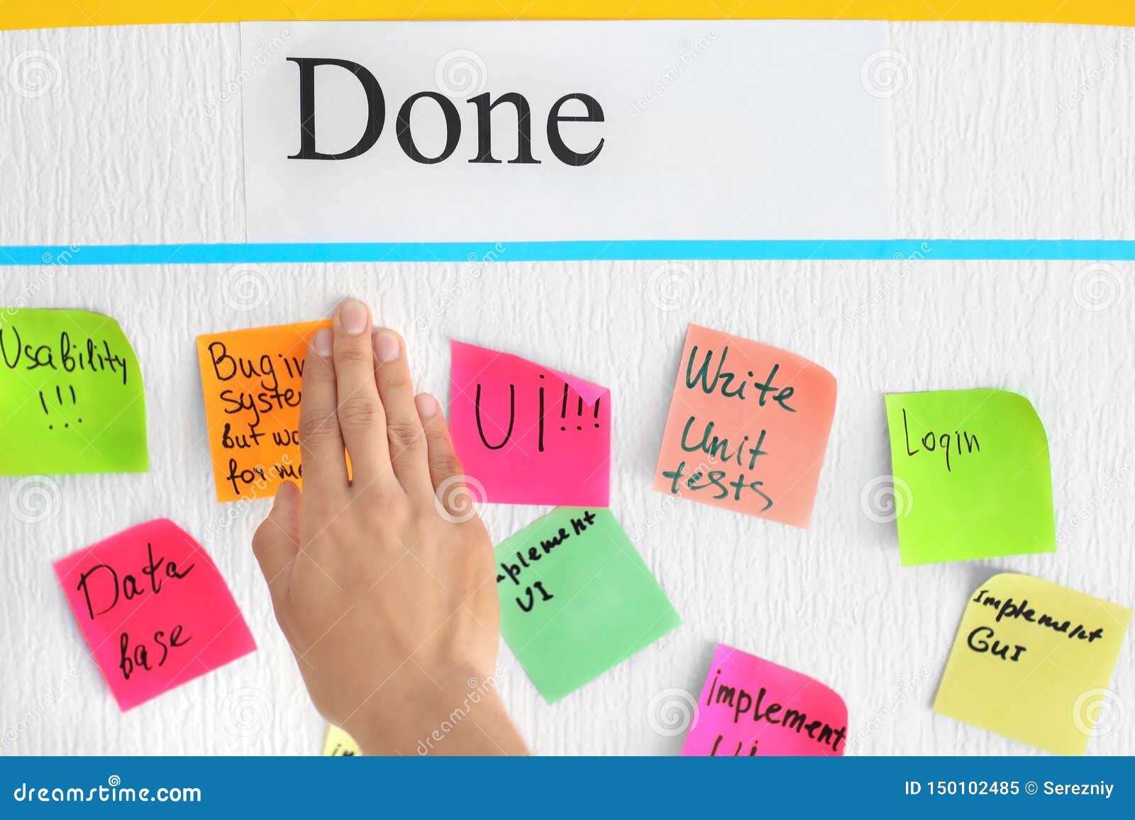Man Attaching Sticky Note To Scrum Task Board in Office Stock Image ...