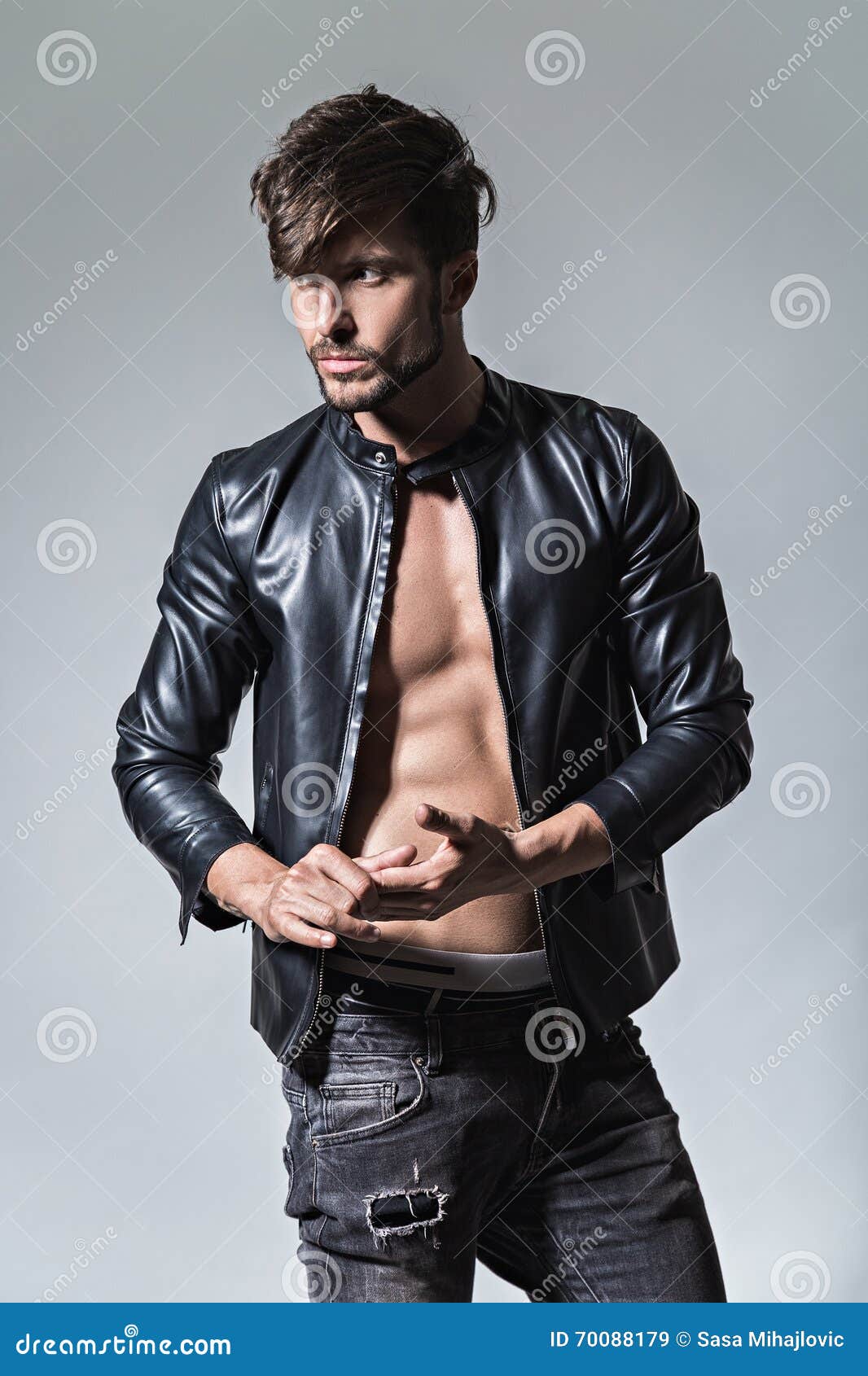 Man with Attitude in Leather Jacket and Jeans Looking To the Sid Stock ...