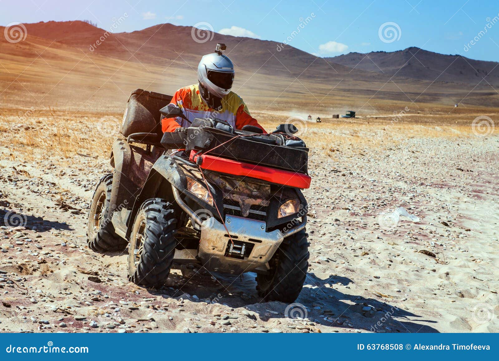 Man on ATV Rides through the Mountainside Stock Photo - Image of person ...