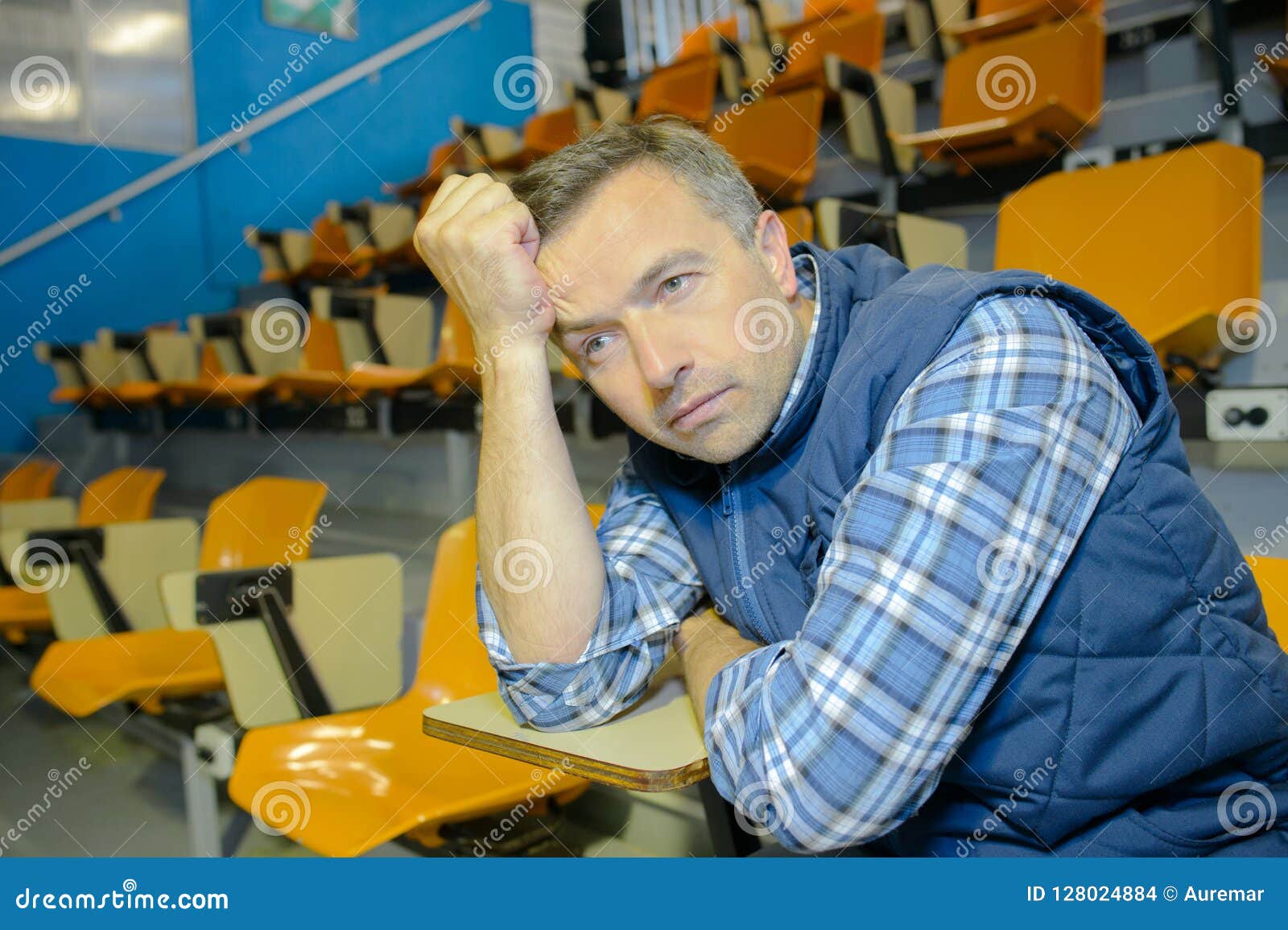 Man in Auditorium Looking Fed Up Stock Photo - Image of unhappy ...