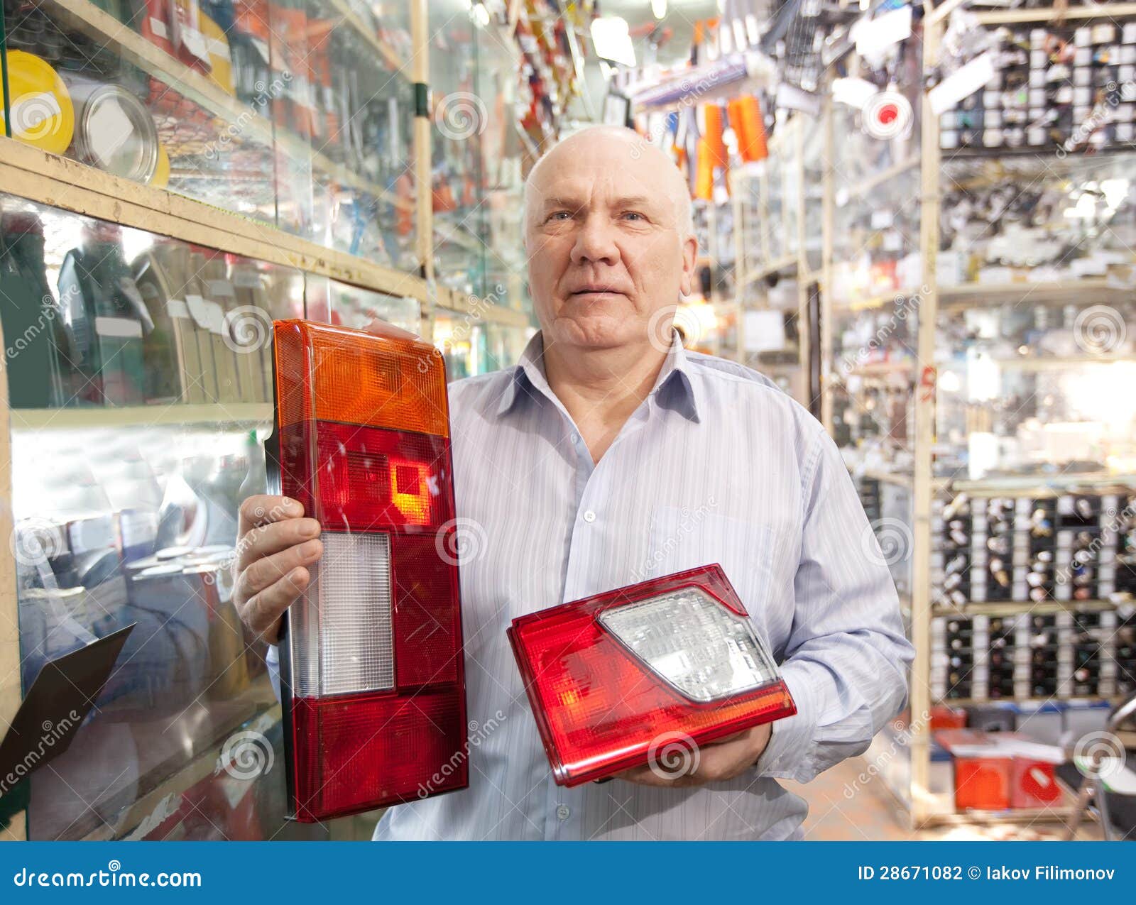 Man in auto parts store stock photo. Image of headlight - 28671082