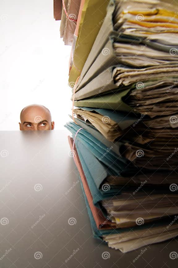 Man Avoiding Work stock photo. Image of file, pile, folder - 2183120