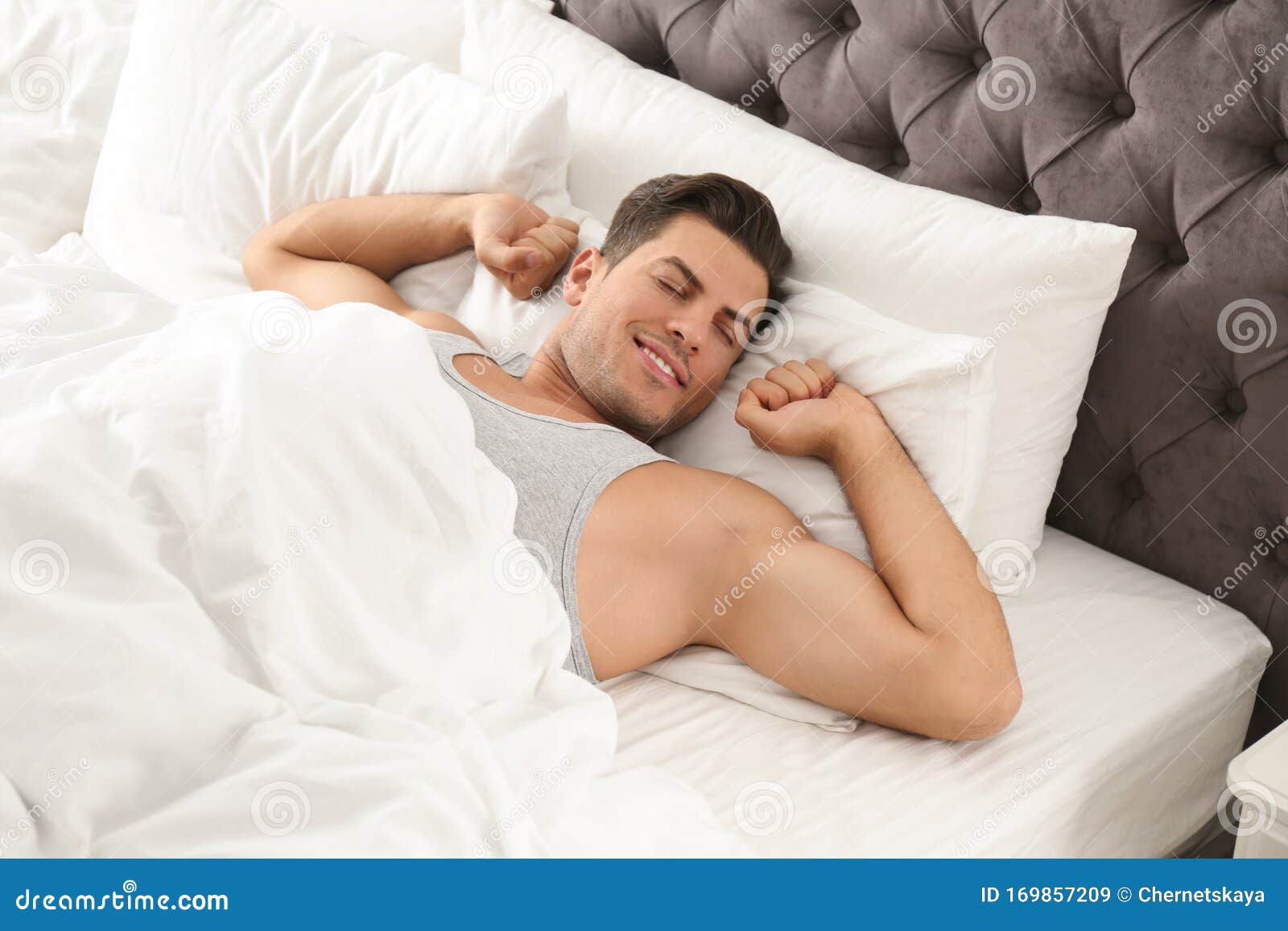 Man Awakening on Bed at Home Stock Image - Image of cozy, male: 169857209