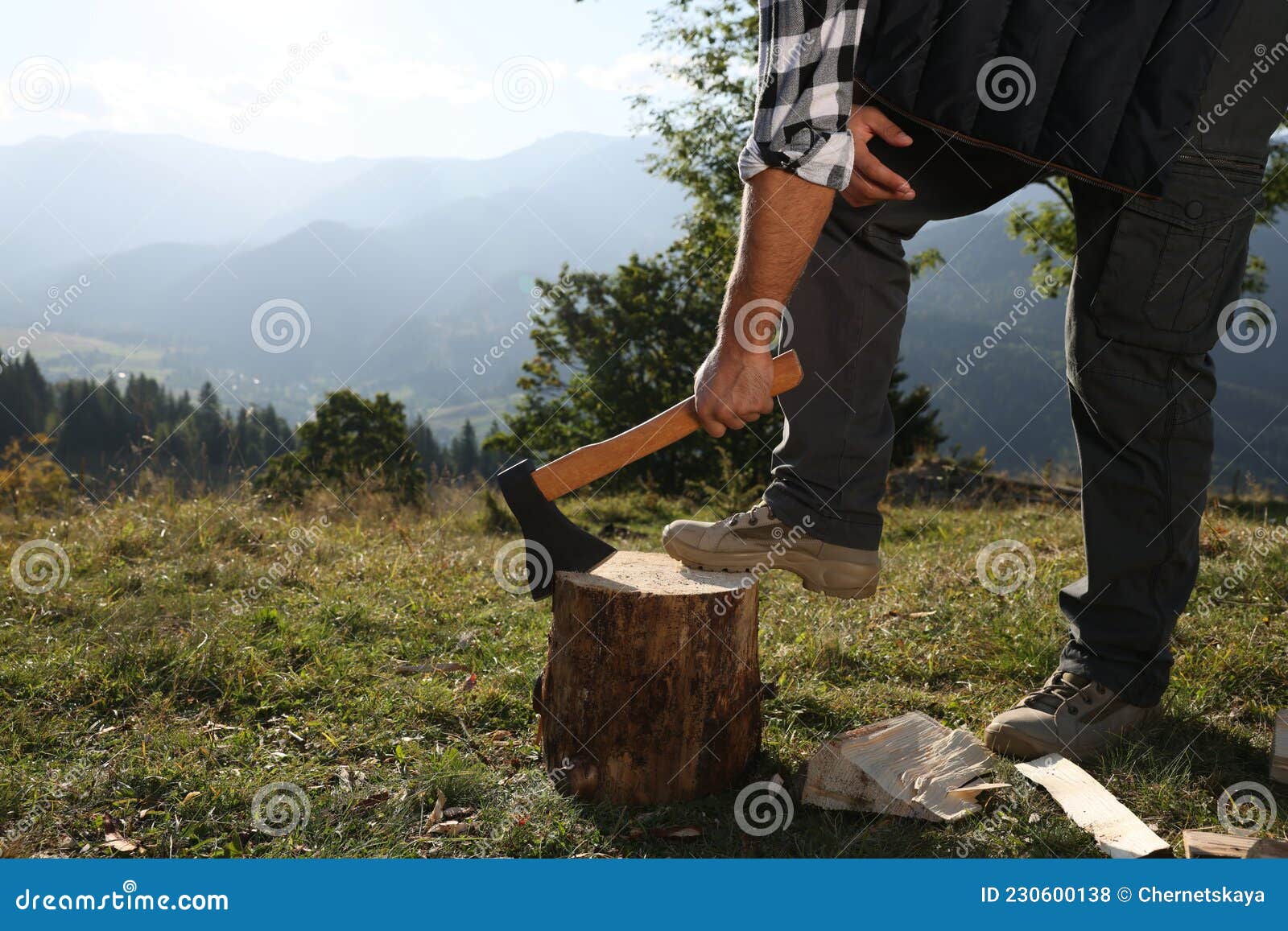 Man with Axe Cutting Firewood in Mountains, Closeup Stock Photo - Image ...