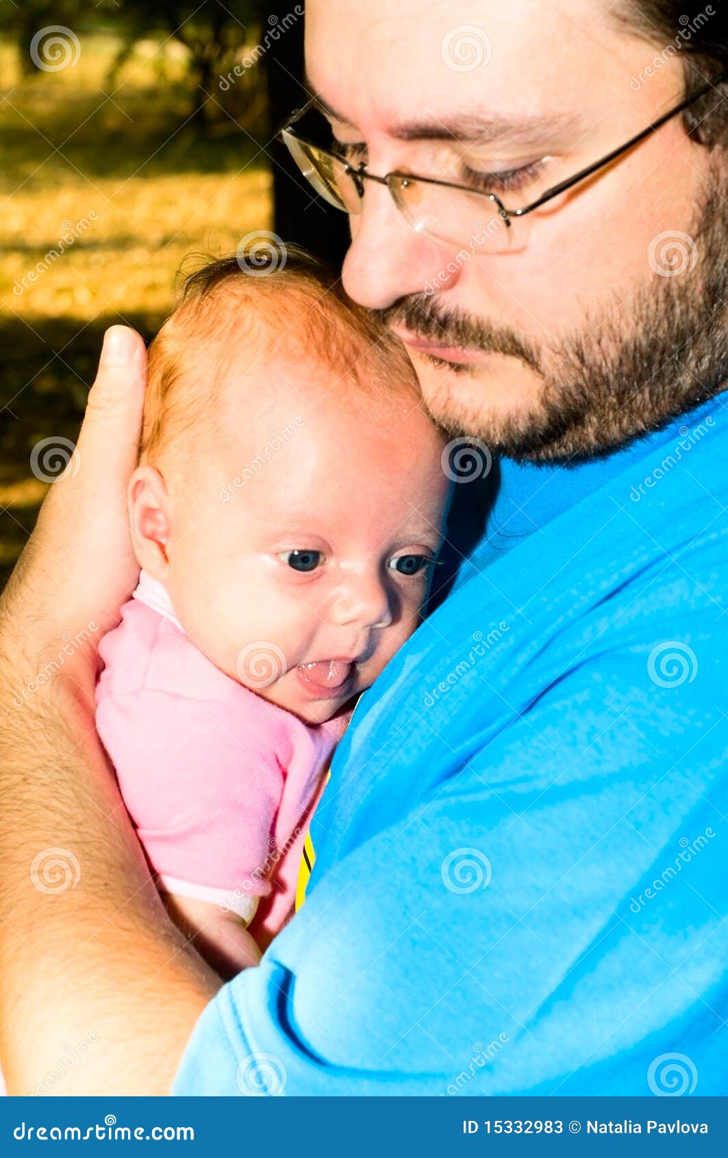 Man with baby stock image. Image of face, sunlight, park - 15332983