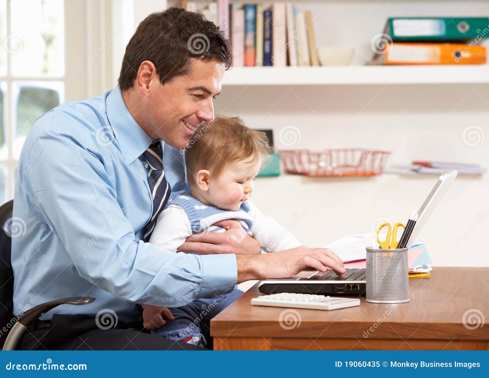 Man with Baby Working from Home Using Laptop Stock Image - Image of ...