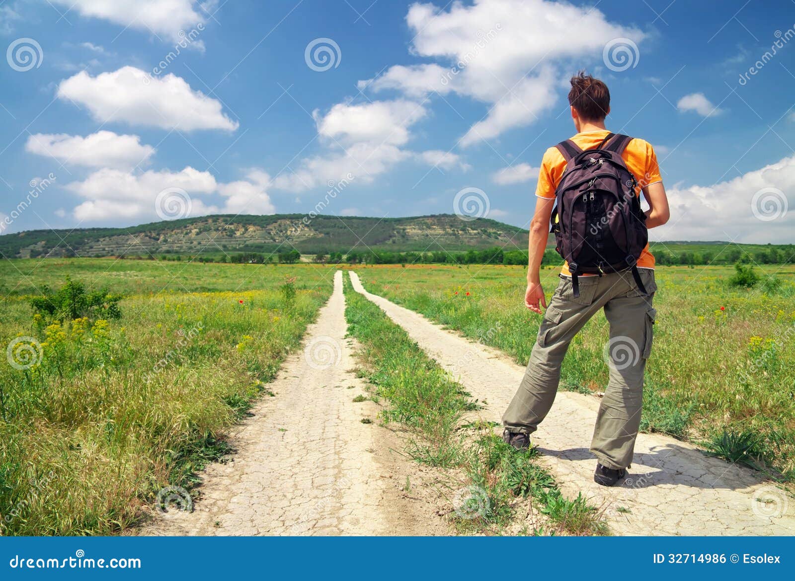 Man with a Backpack on a Country Road. Man Tourist Stock Photo - Image ...