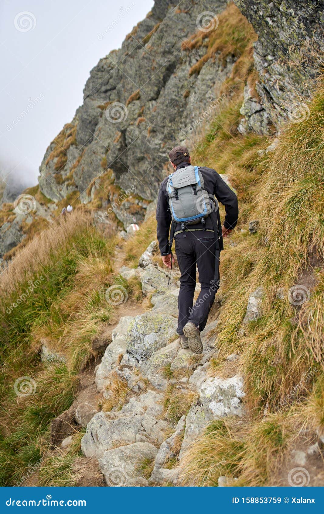 Man with backpack hiking stock image. Image of outdoors - 158853759