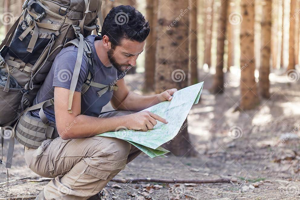 Man with Backpack and Map Searching Directions Stock Image - Image of ...