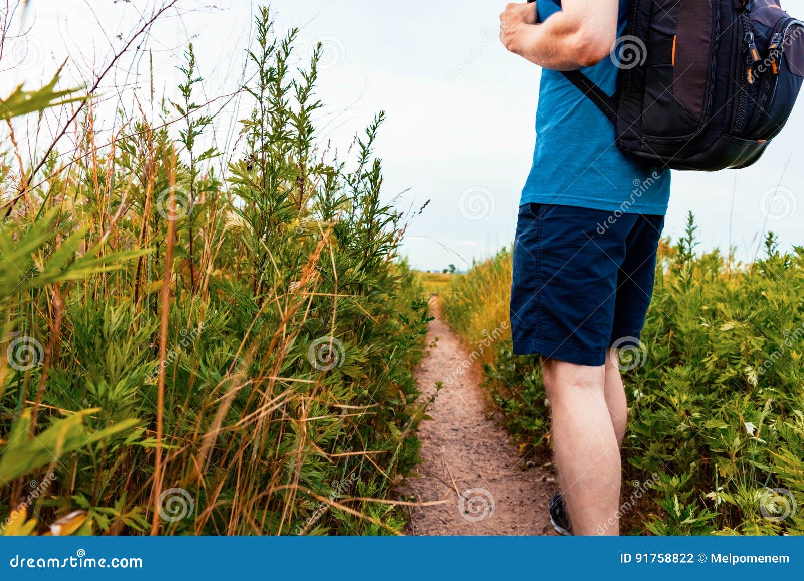 Man with a Backpack Walking Down a Trail Stock Photo - Image of ...