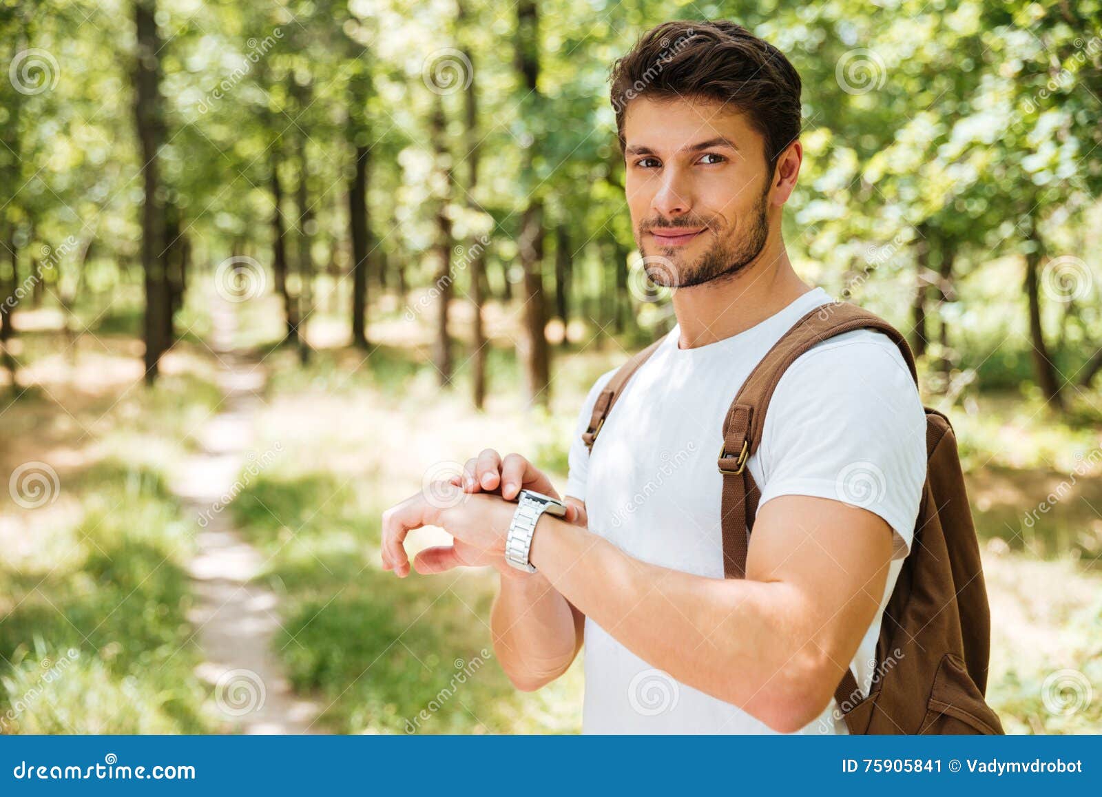 Man with Backpack and Watch Standing in Forest Stock Image - Image of ...