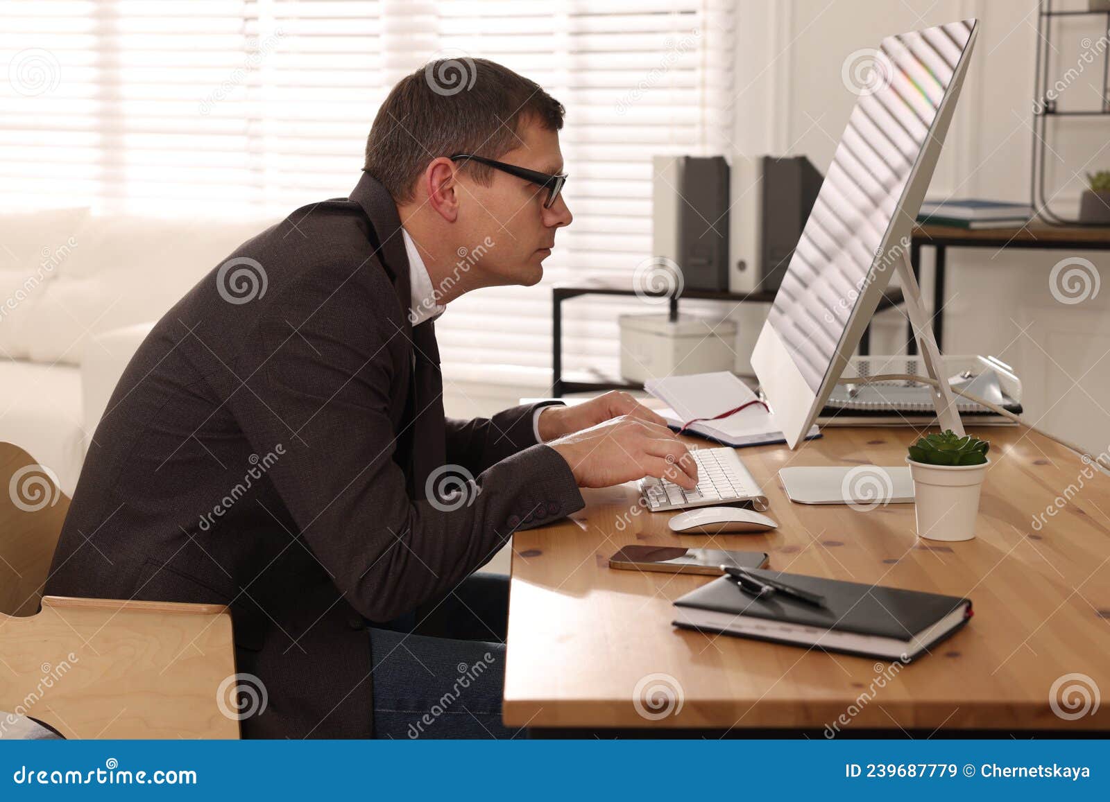 Man with Bad Posture Working on Computer in Office Stock Image - Image ...