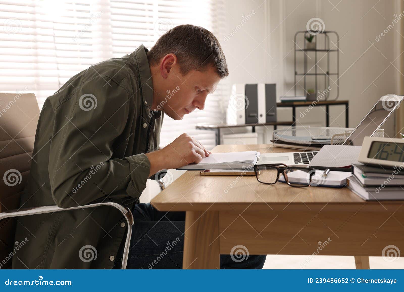 Man with Bad Posture Working at Table in Office Stock Photo - Image of ...