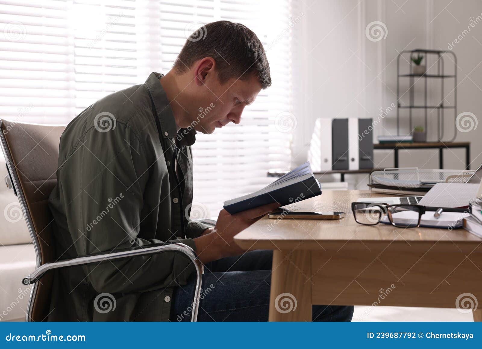 Man with Bad Posture Working at Table in Office Stock Photo - Image of ...