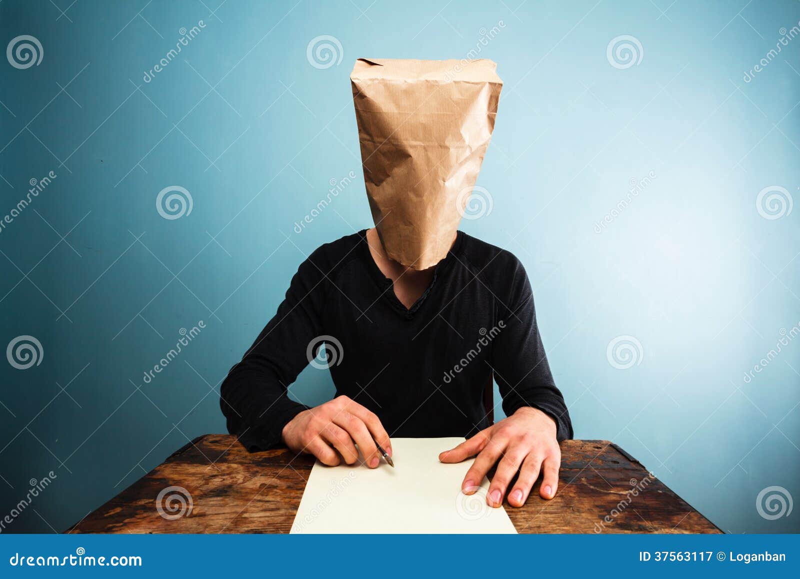 Man with Bag Over Head Writing Letter Stock Image - Image of hidden ...