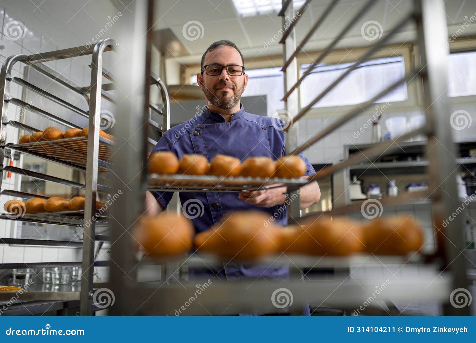 Man Baker with Trays of Fresh Bread in Bakery. Stock Image - Image of ...