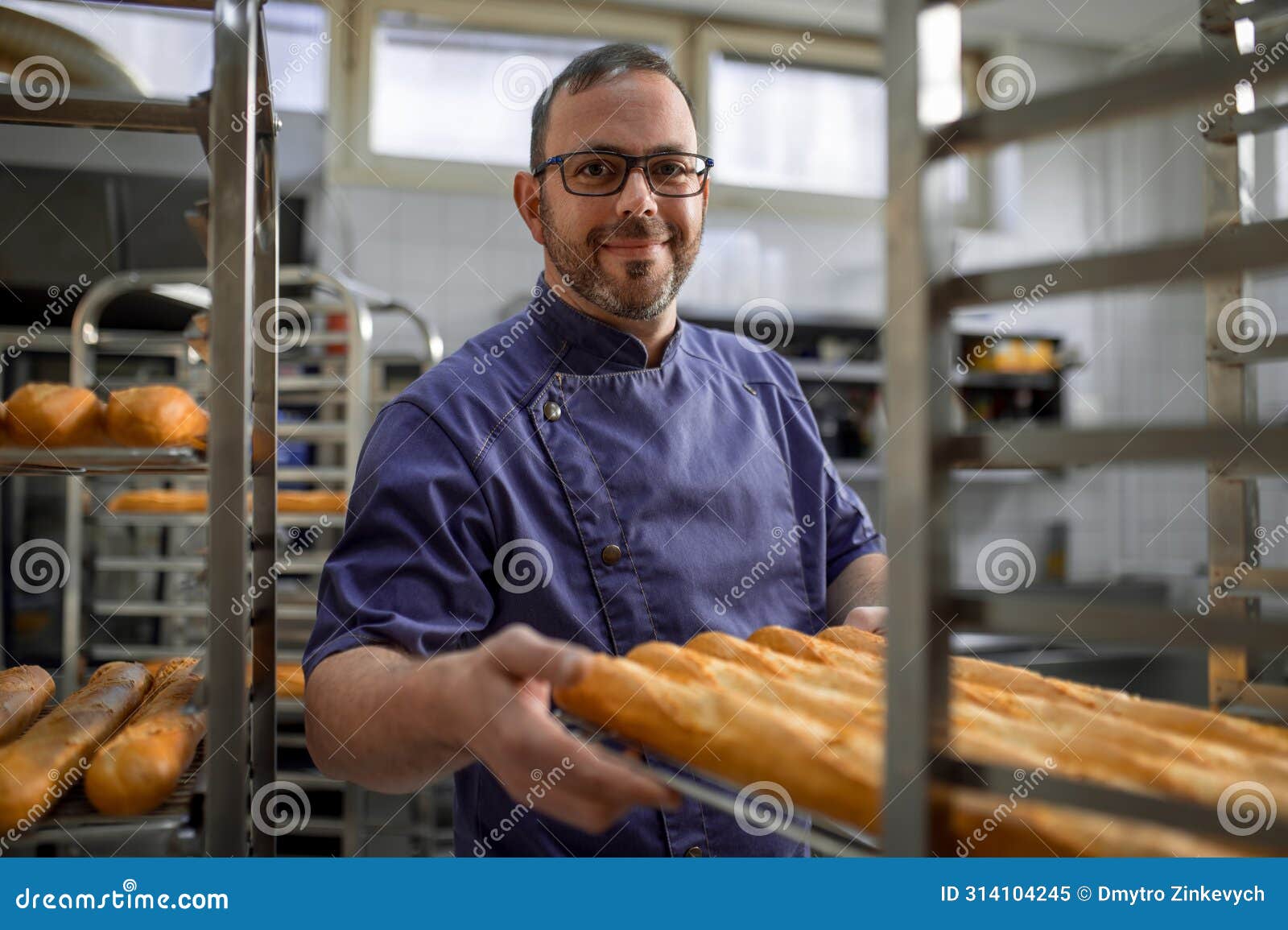 Man Baker with Trays of Fresh Bread in Bakery. Stock Image - Image of ...