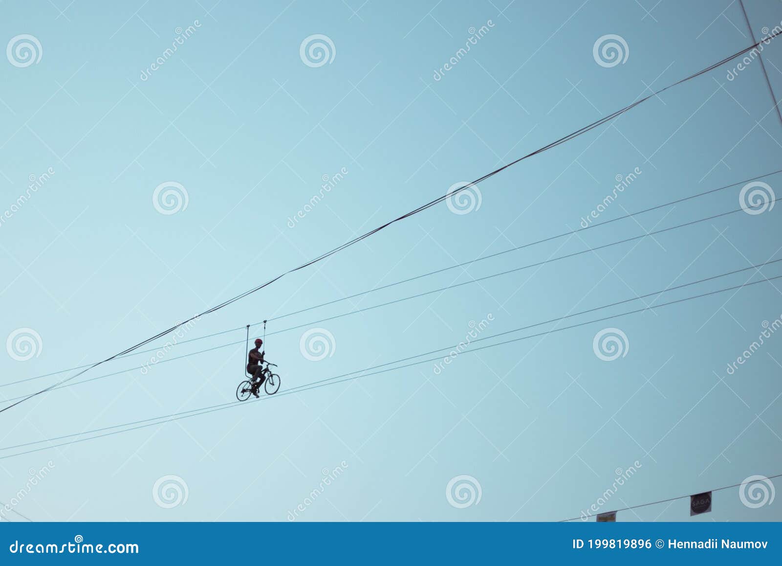 Man Balancing on a Bicycle on a Rope Stock Photo - Image of young, male ...