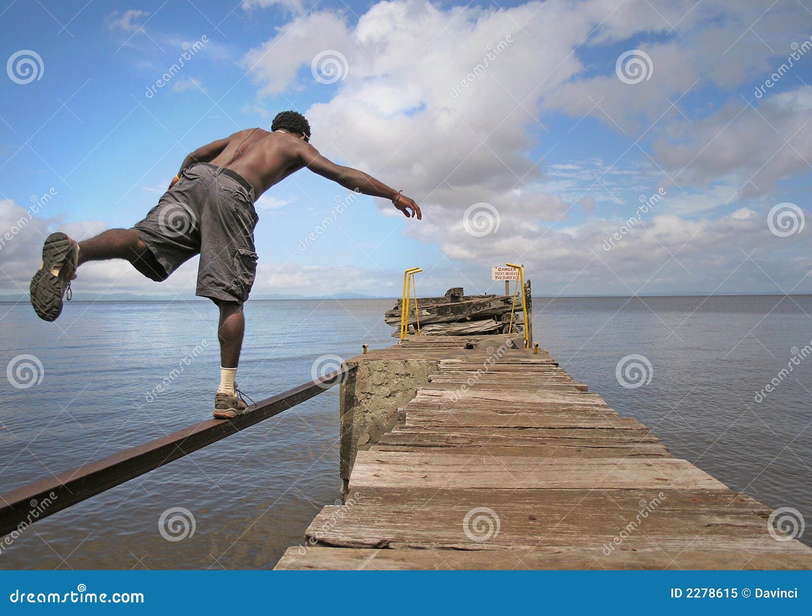 Man balancing on a pier stock image. Image of vacation - 2278615
