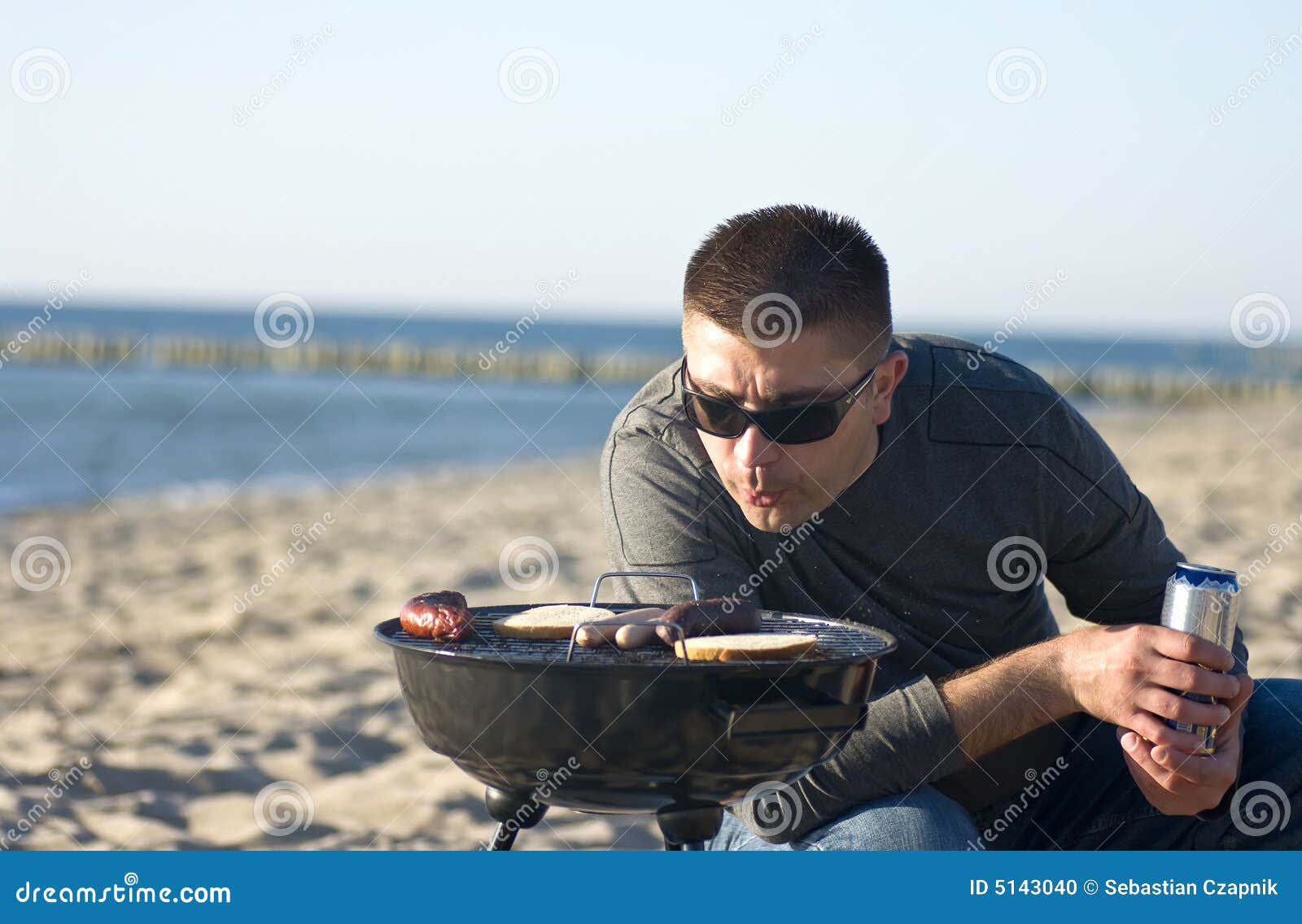 Man and barbecue on beach stock photo. Image of male, garden - 5143040