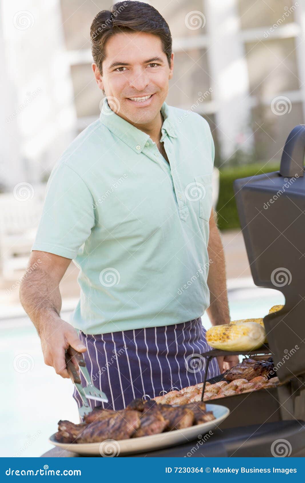 Man Barbequing in a Garden stock photo. Image of american - 7230364