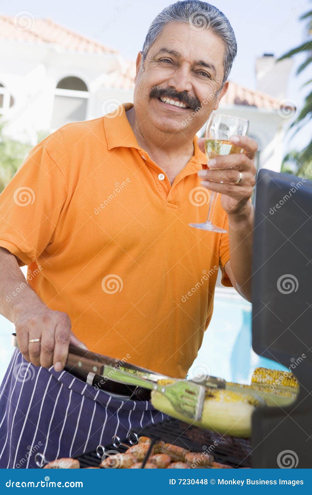 Man Barbequing in a Garden stock photo. Image of barbeque - 7230448