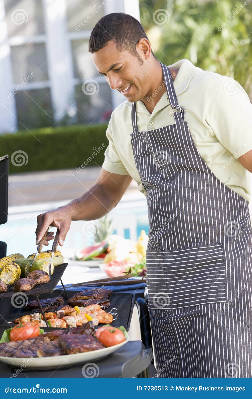 Man Barbequing in a Garden stock image. Image of outside - 7230513