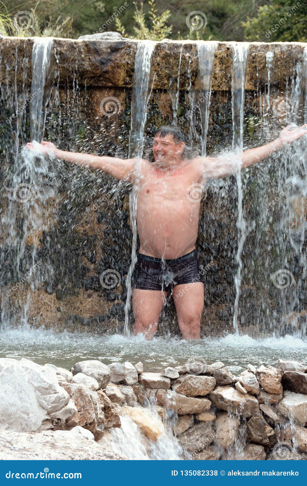 Man Bathes in a Mountain Stream Falls on the Stones in Nature Stock ...