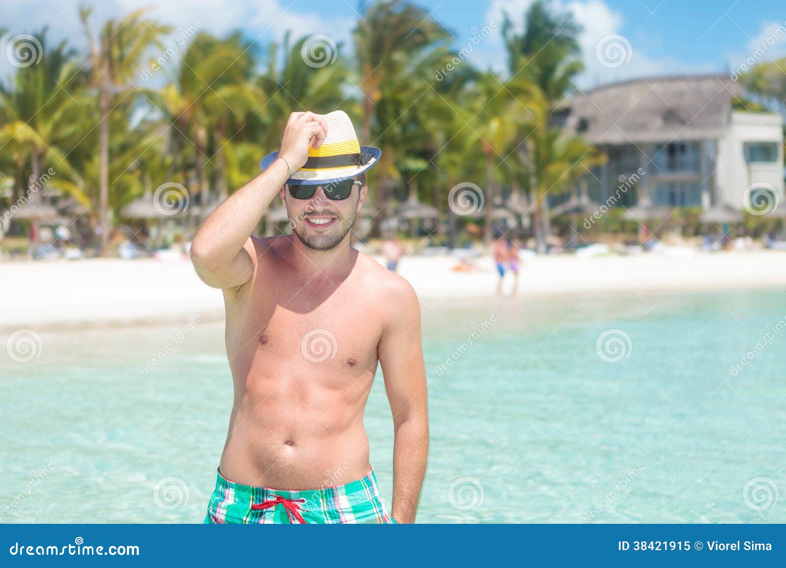 Man in Bathing Suit Holding His Hat at the Beach Stock Image - Image of ...
